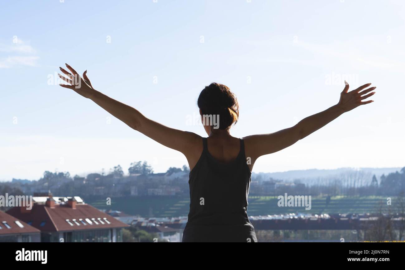 woman raising her arms Stock Photo - Alamy
