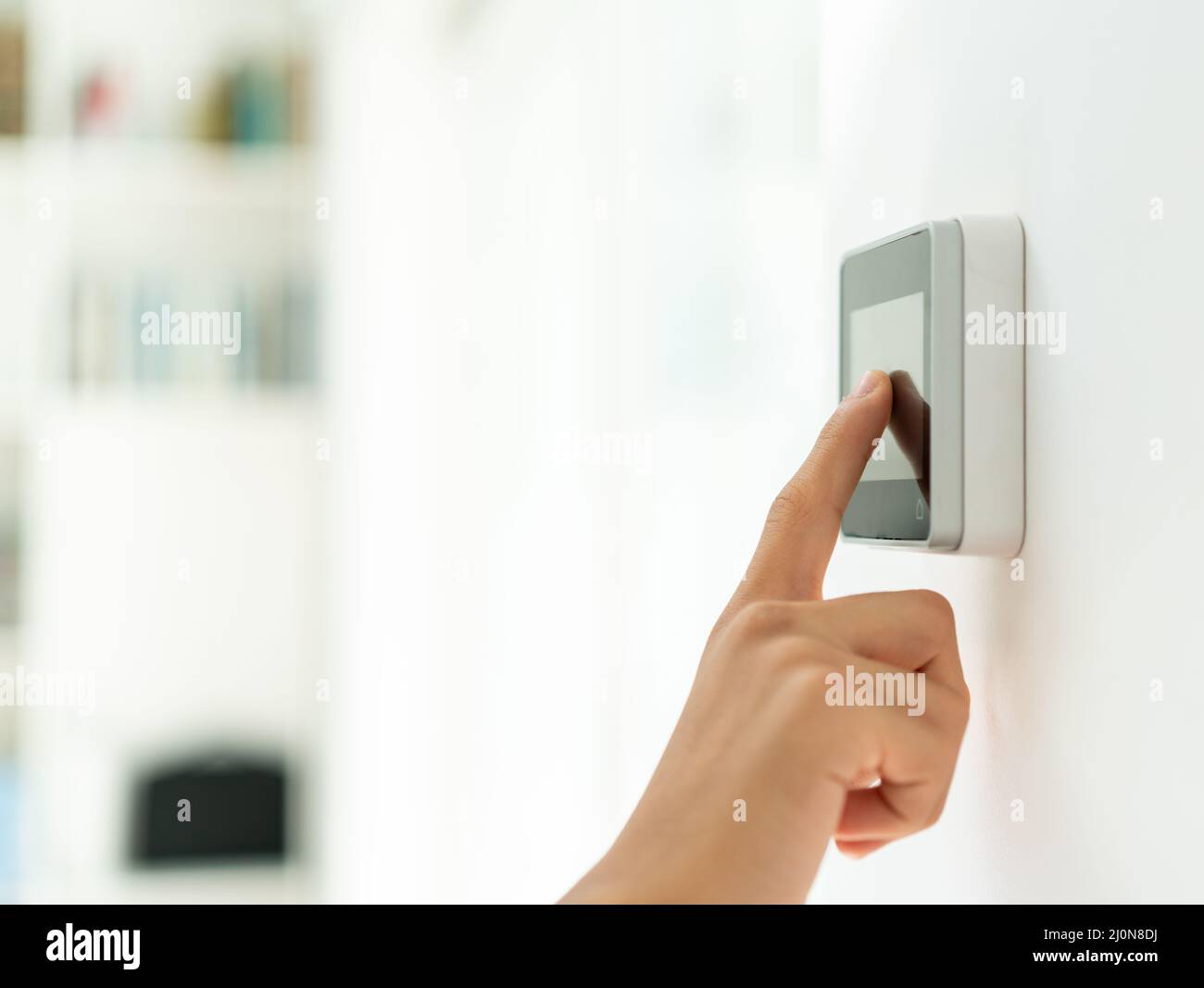 Smart house, home automation, device with app icons. Man uses his ...