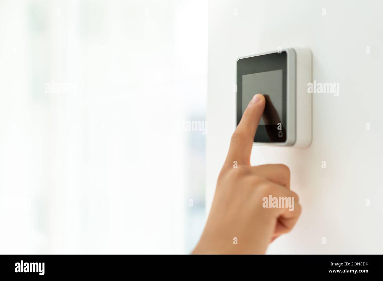 Smart house, home automation, device with app icons. Man uses his ...