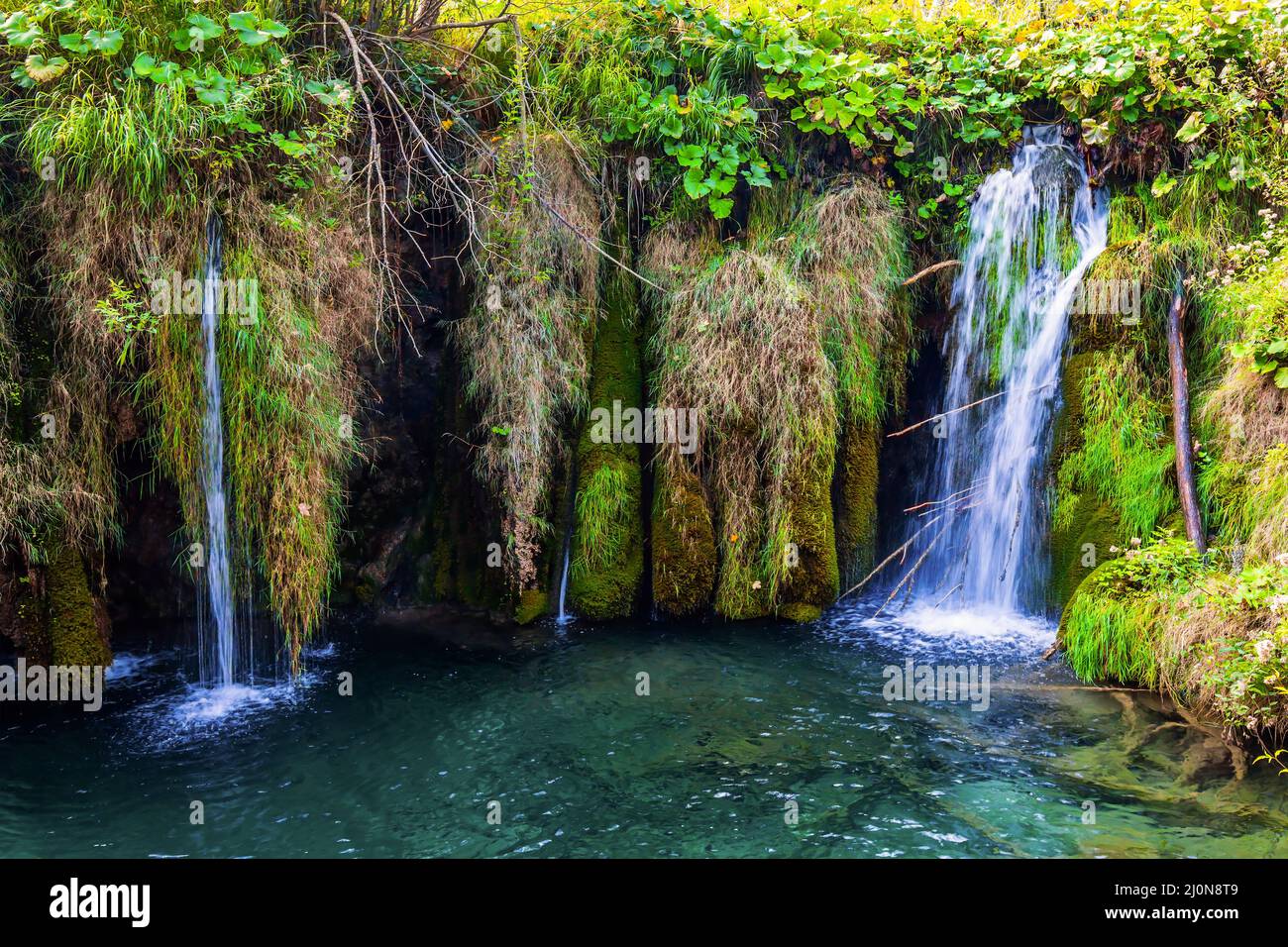 The waterfalls flow along the cliffs Stock Photo - Alamy