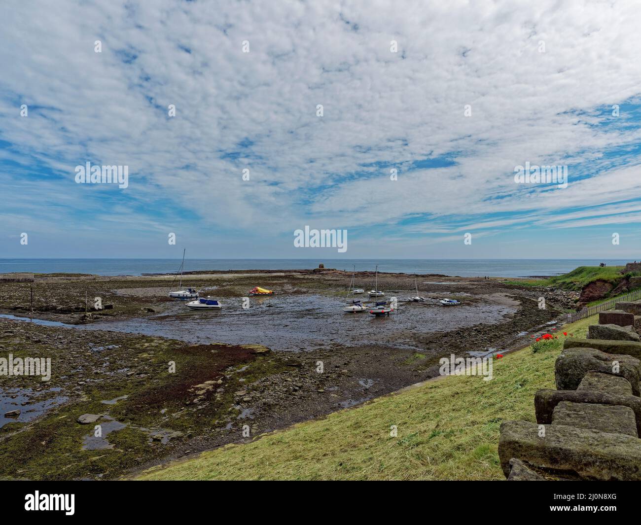 The Inner Basin at the Old Harbour of Seahouses with Yachts lying on ...
