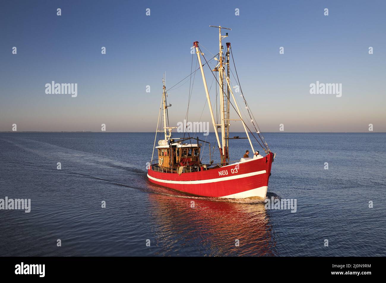Shrimp cutter in front of the harbor entrance to Neuharlingersiel ...