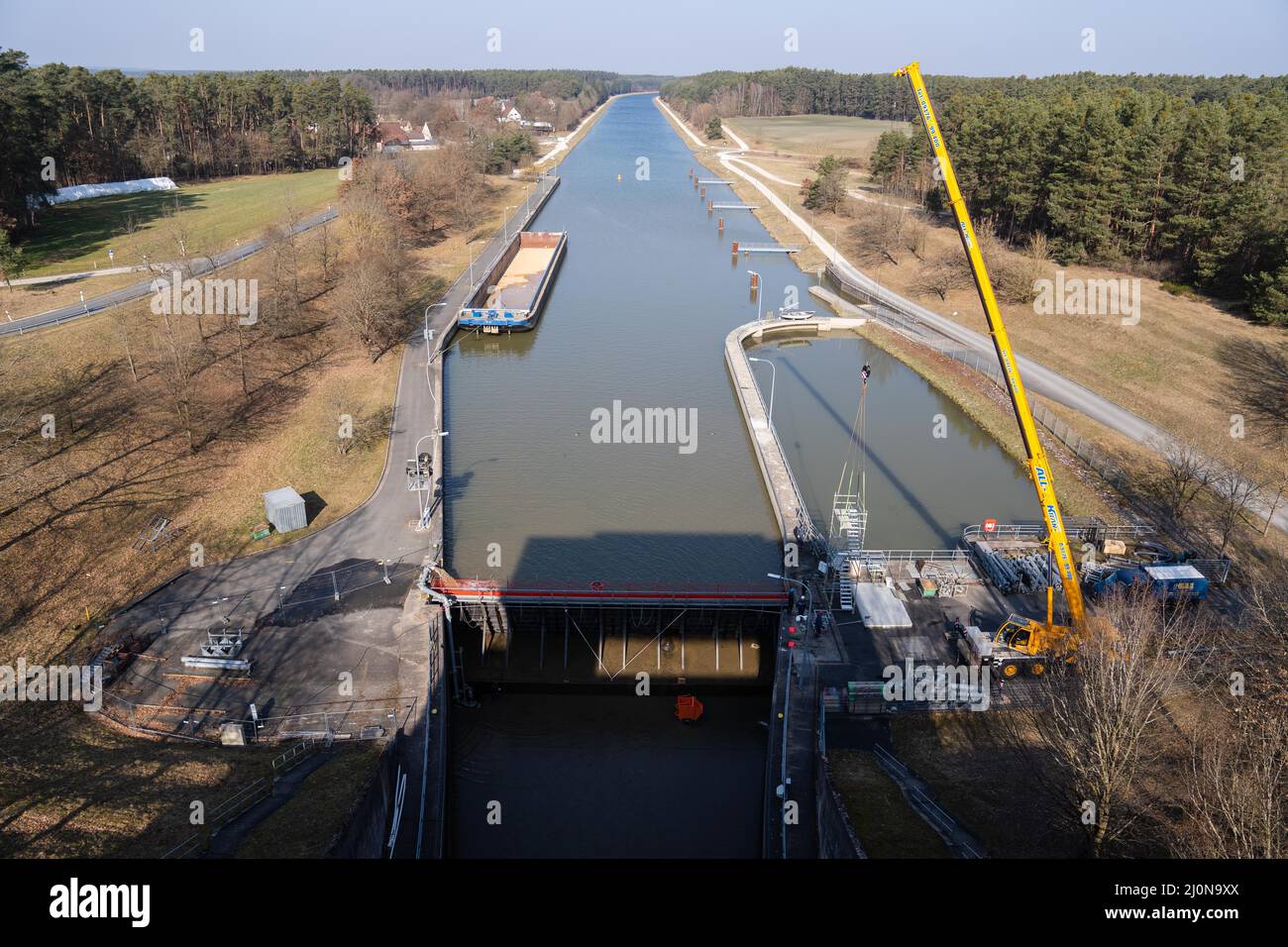 Roth, Germany. 20th Mar, 2022. The sun shines on the Main-Danube Canal ...