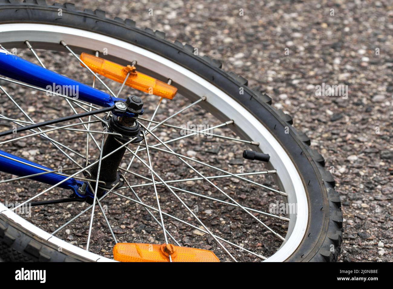 View of a bicycle front wheel Stock Photo - Alamy