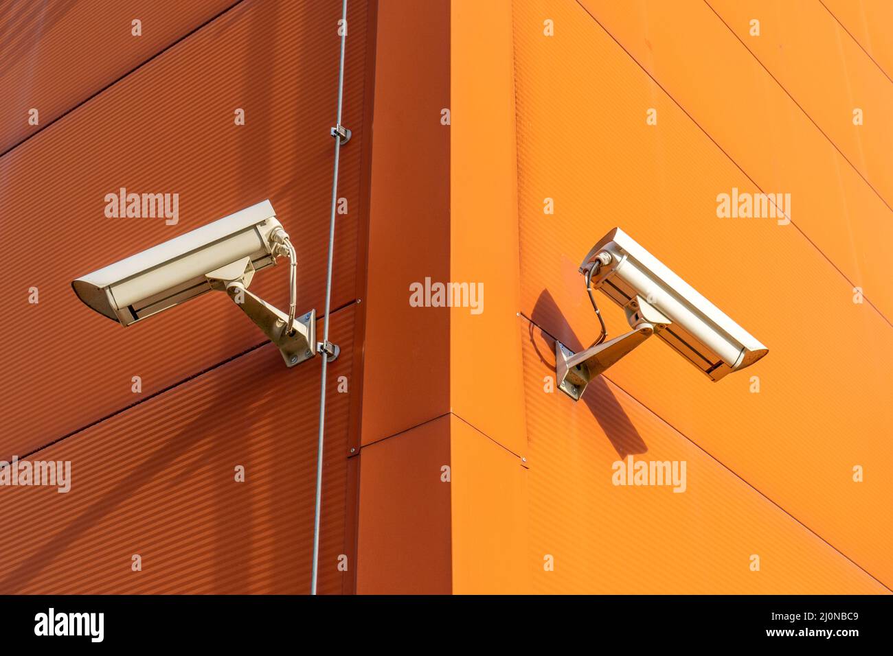 Two CCTV cameras on the building Stock Photo - Alamy