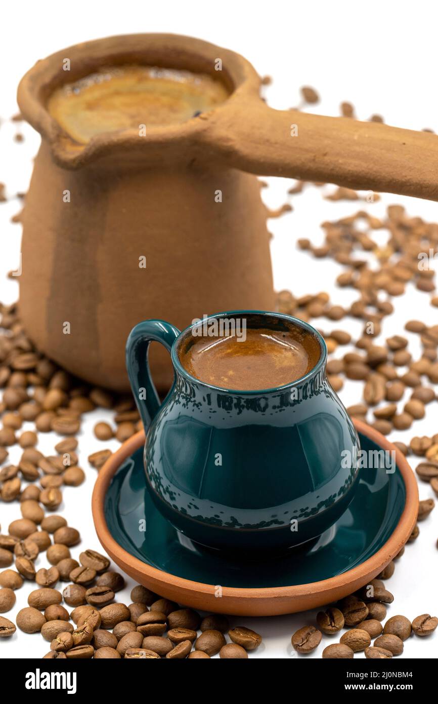 Turkish coffee on a white background. Rustic cup and earthen coffee pot ...