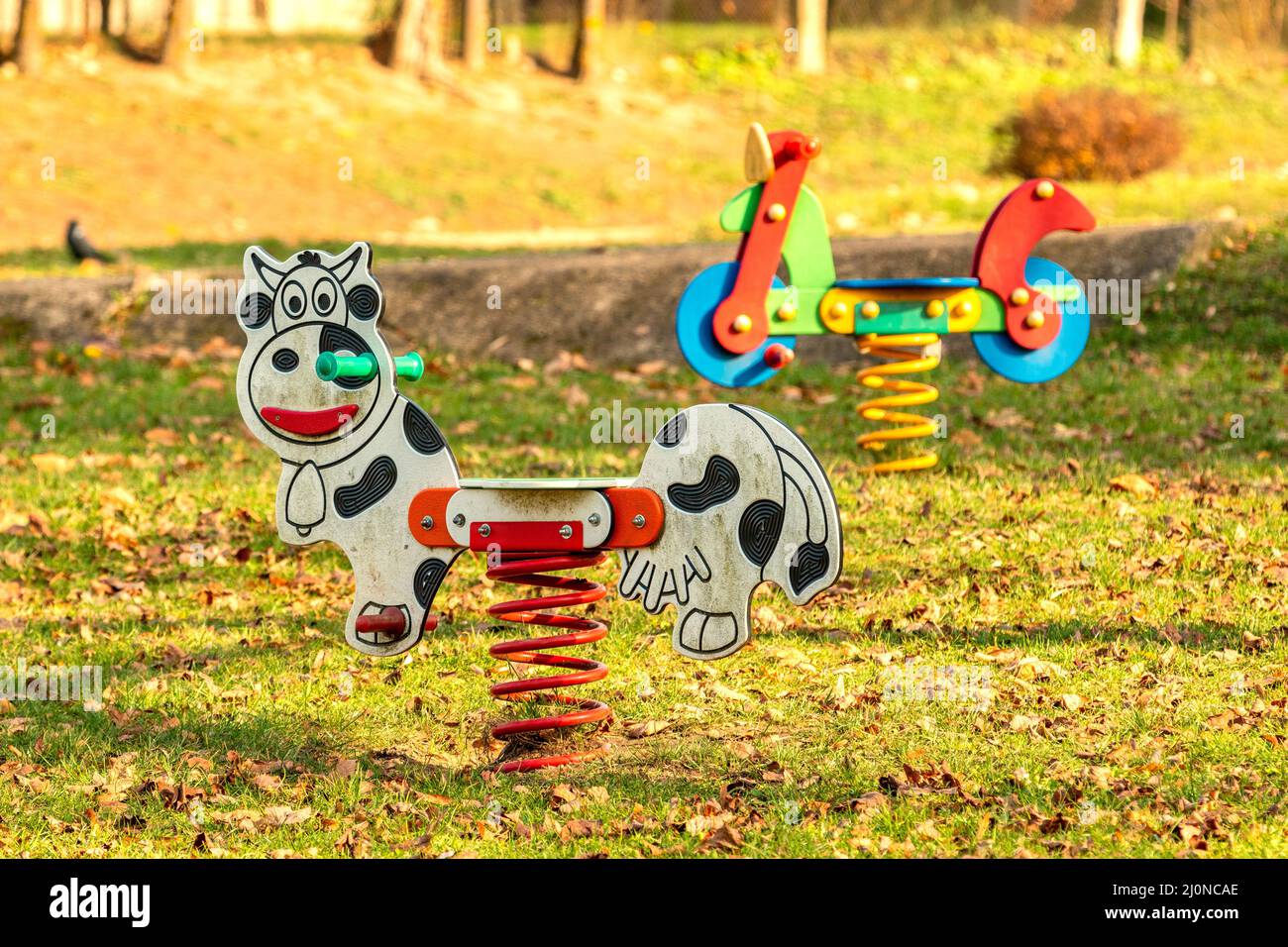 Swings for children on a kids playground Stock Photo - Alamy