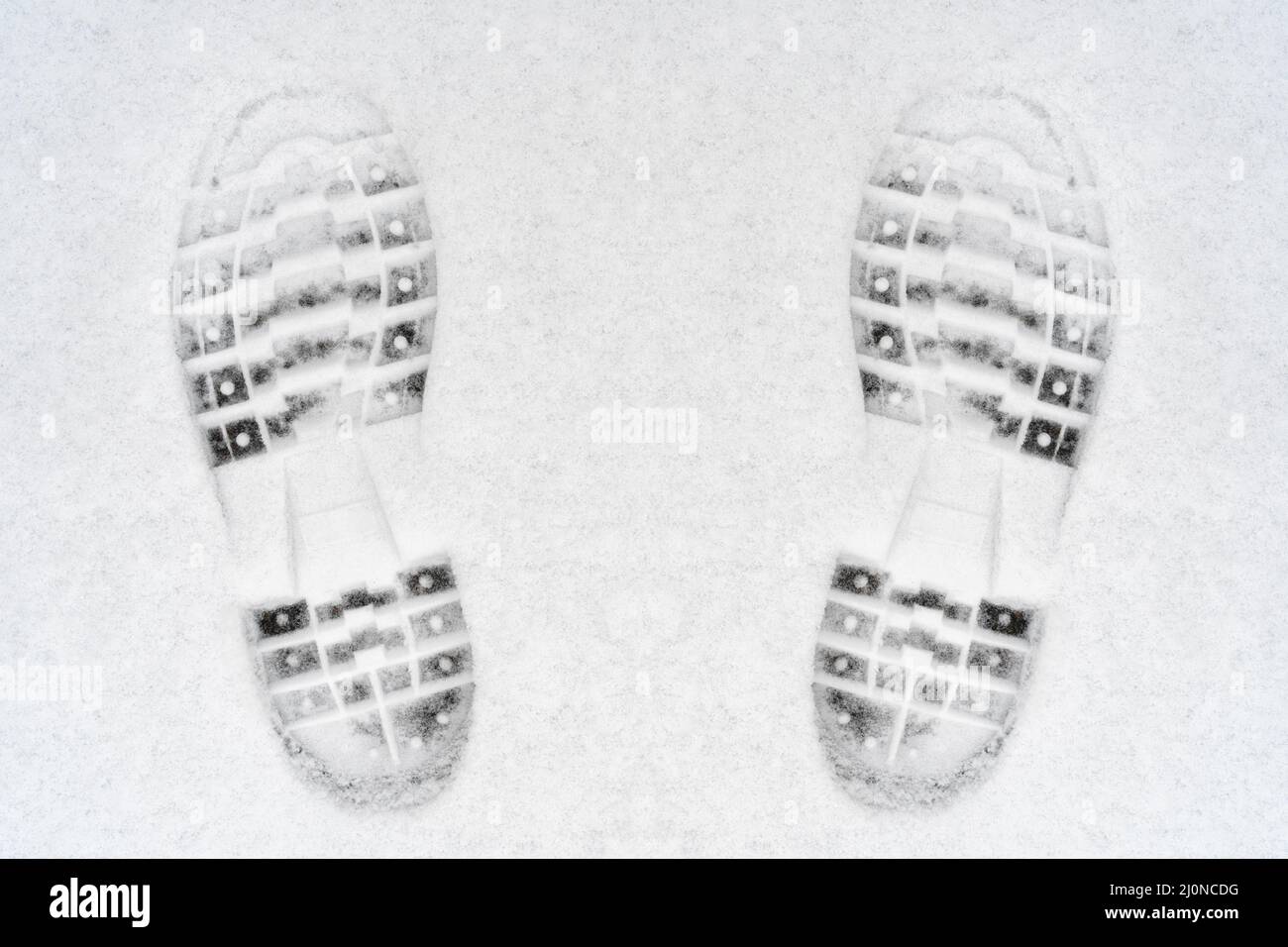 Feet imprint in fresh white snow Stock Photo - Alamy
