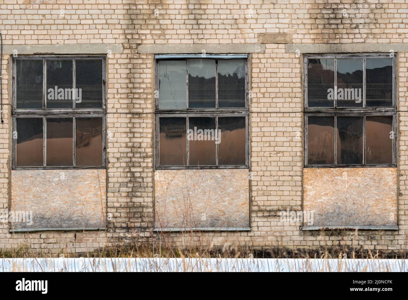 Windows in an old industrial building Stock Photo - Alamy