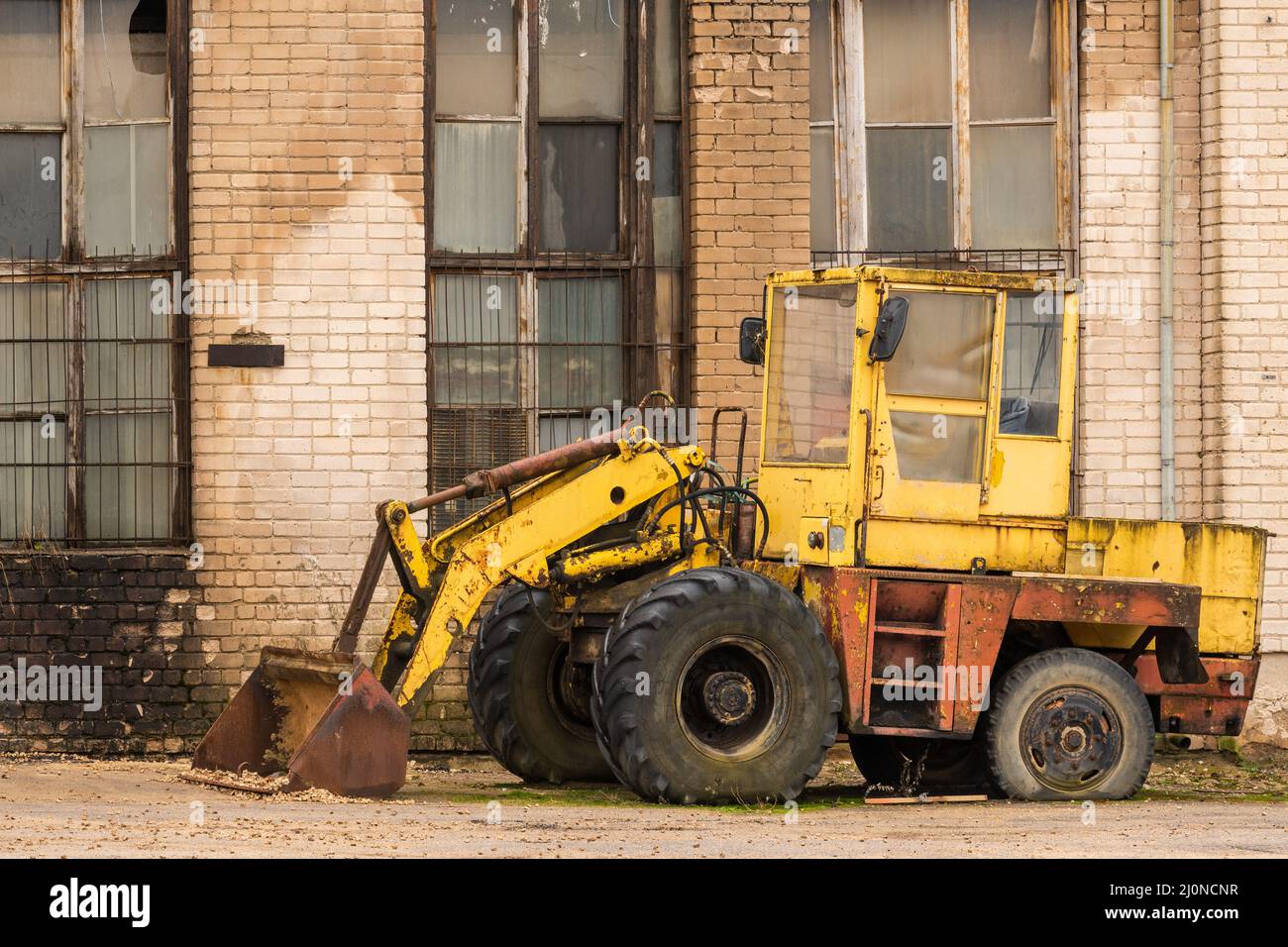 Broken bulldozer in the yard Stock Photo - Alamy