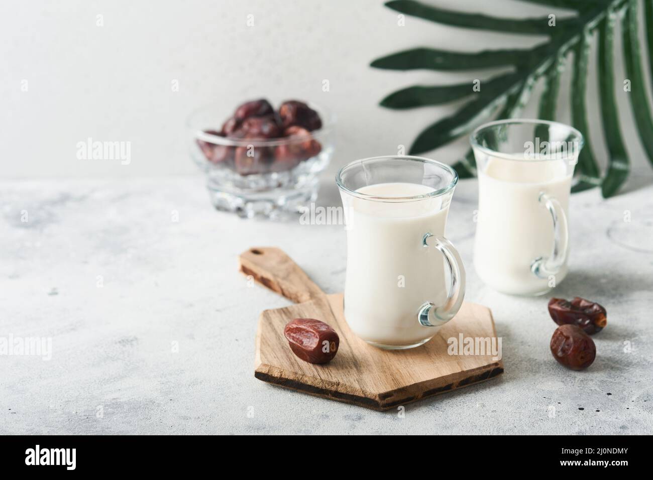 Ramadan Kareem food and drinks. Plate of dates, glass of milk and date ...