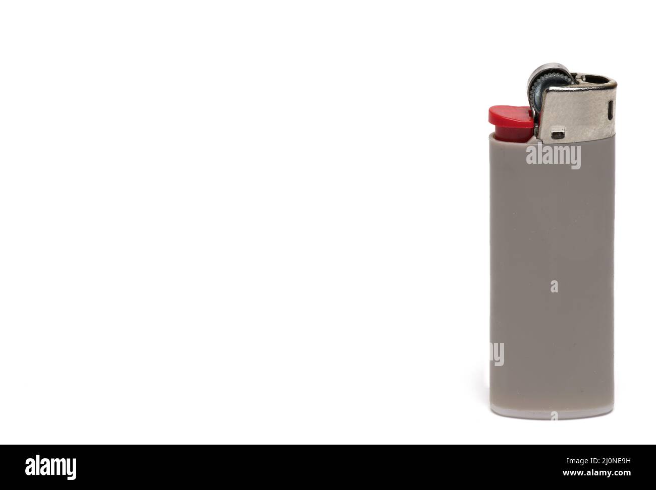 Close up of small modern lighter with red button on white background ...
