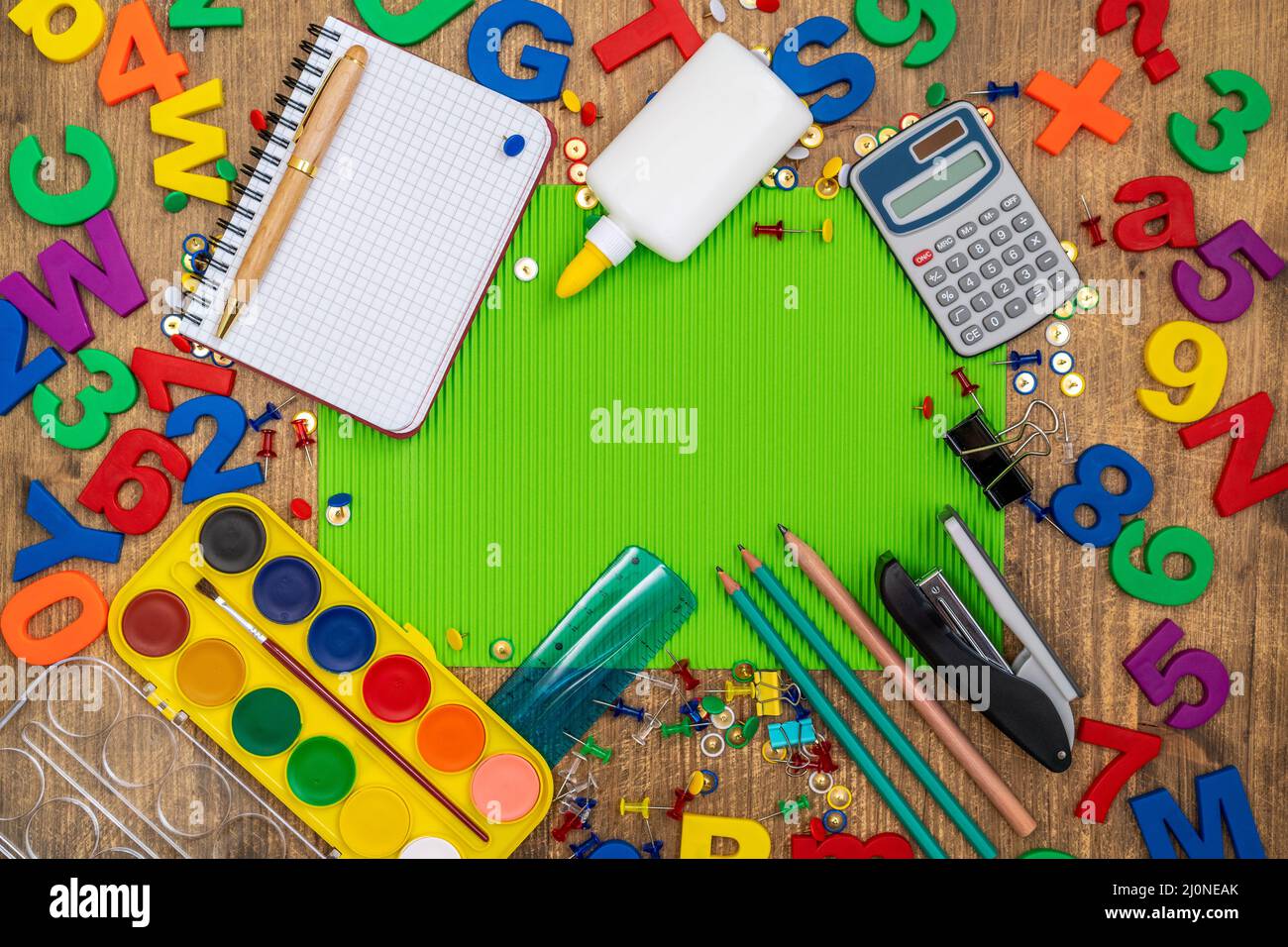 School supplies with green paper sheet Stock Photo - Alamy