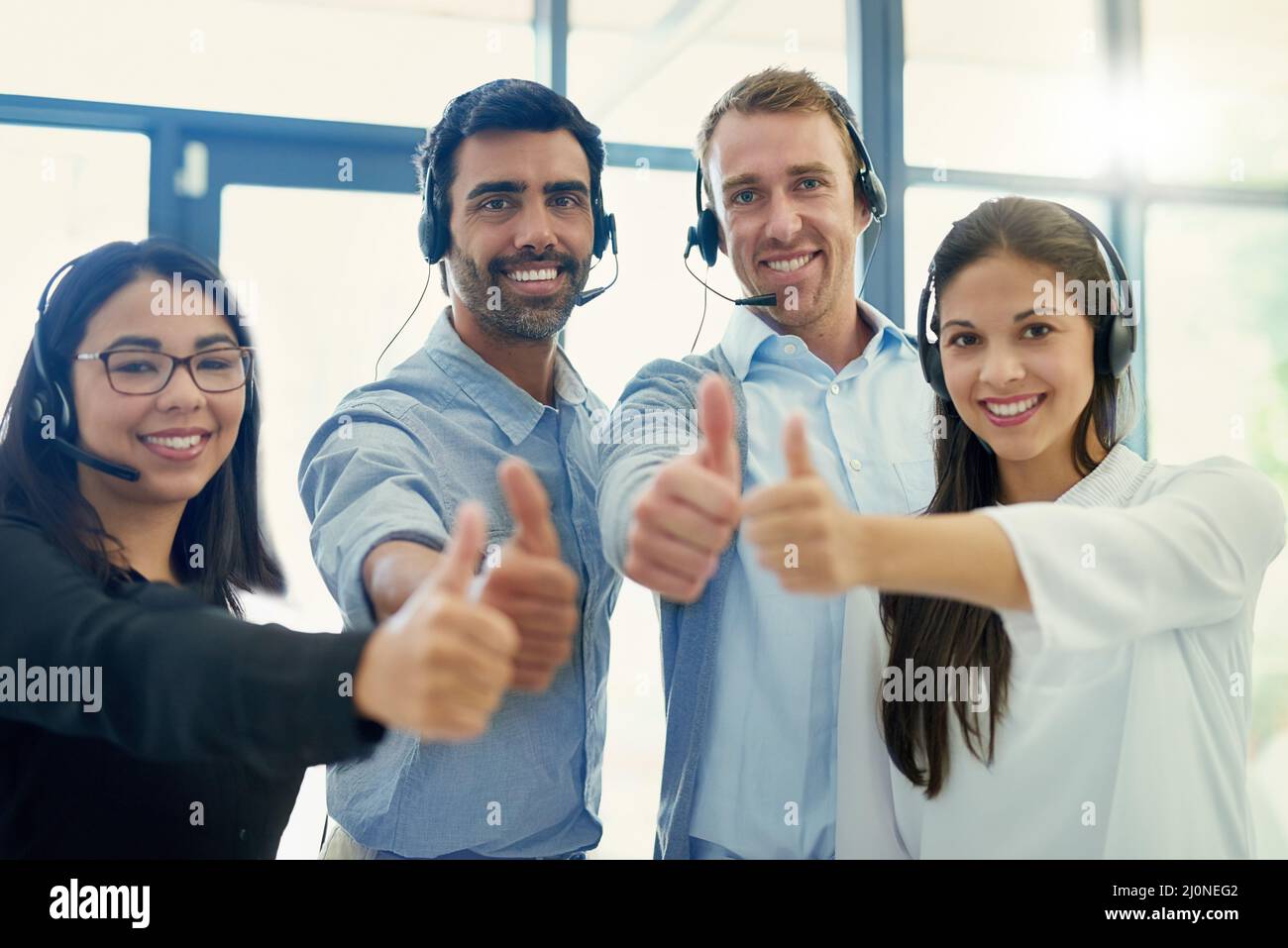 Call center giving thumbs up hi-res stock photography and images - Alamy