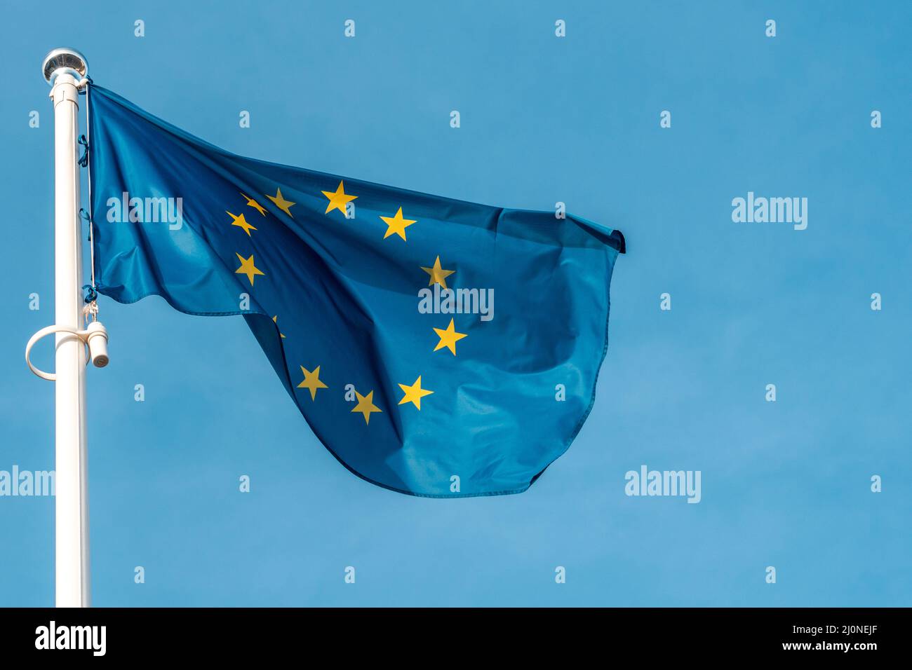 Blue European flag with twelve stars Stock Photo - Alamy