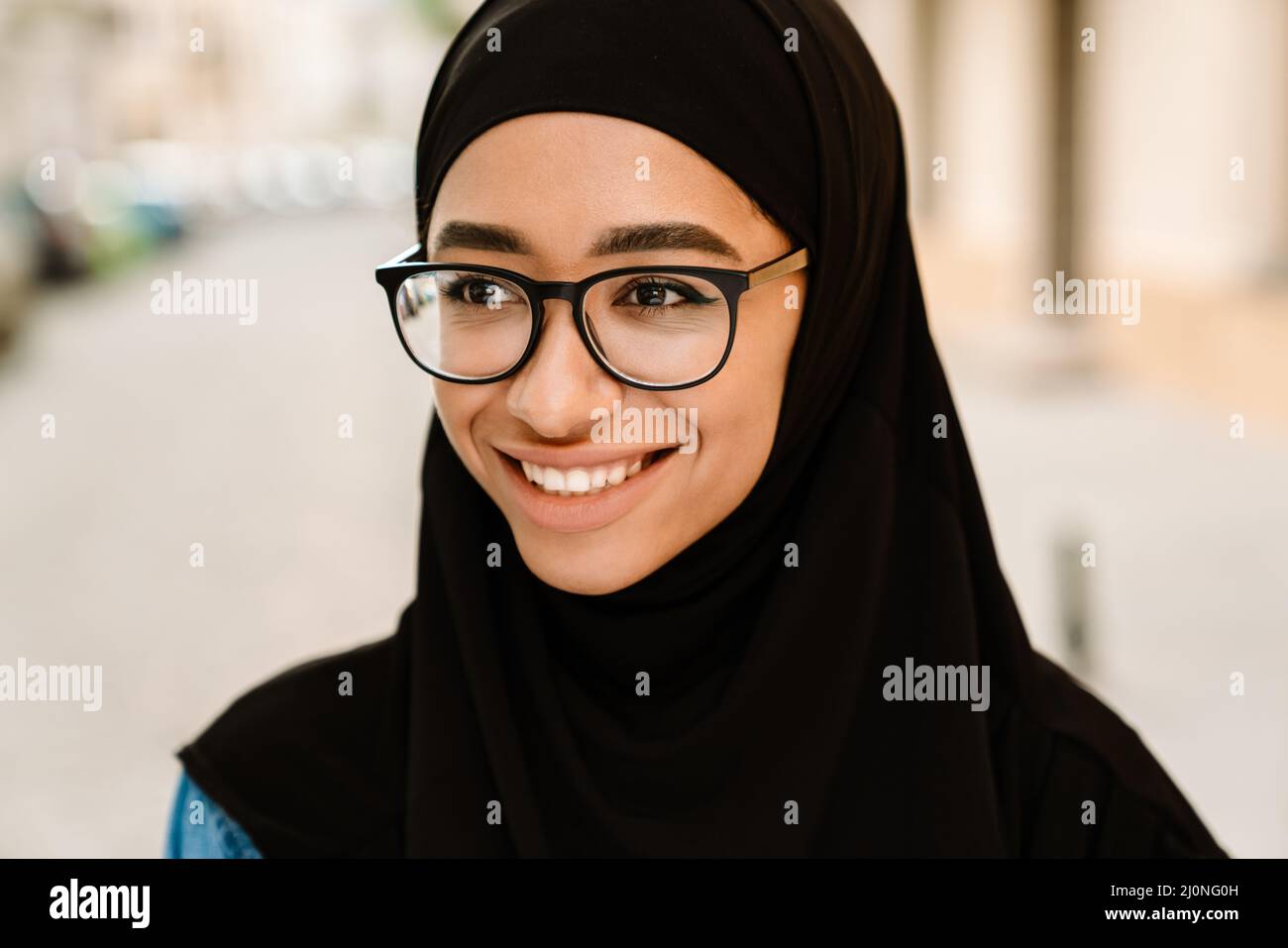 Smiling young muslim woman in hi-res stock photography and images - Alamy