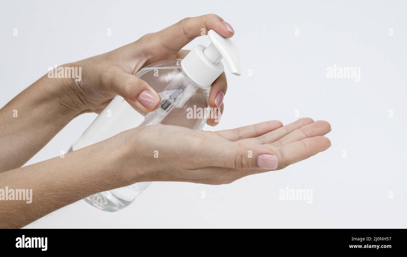 Person pouring liquid soap from bottle with copy space . High quality ...