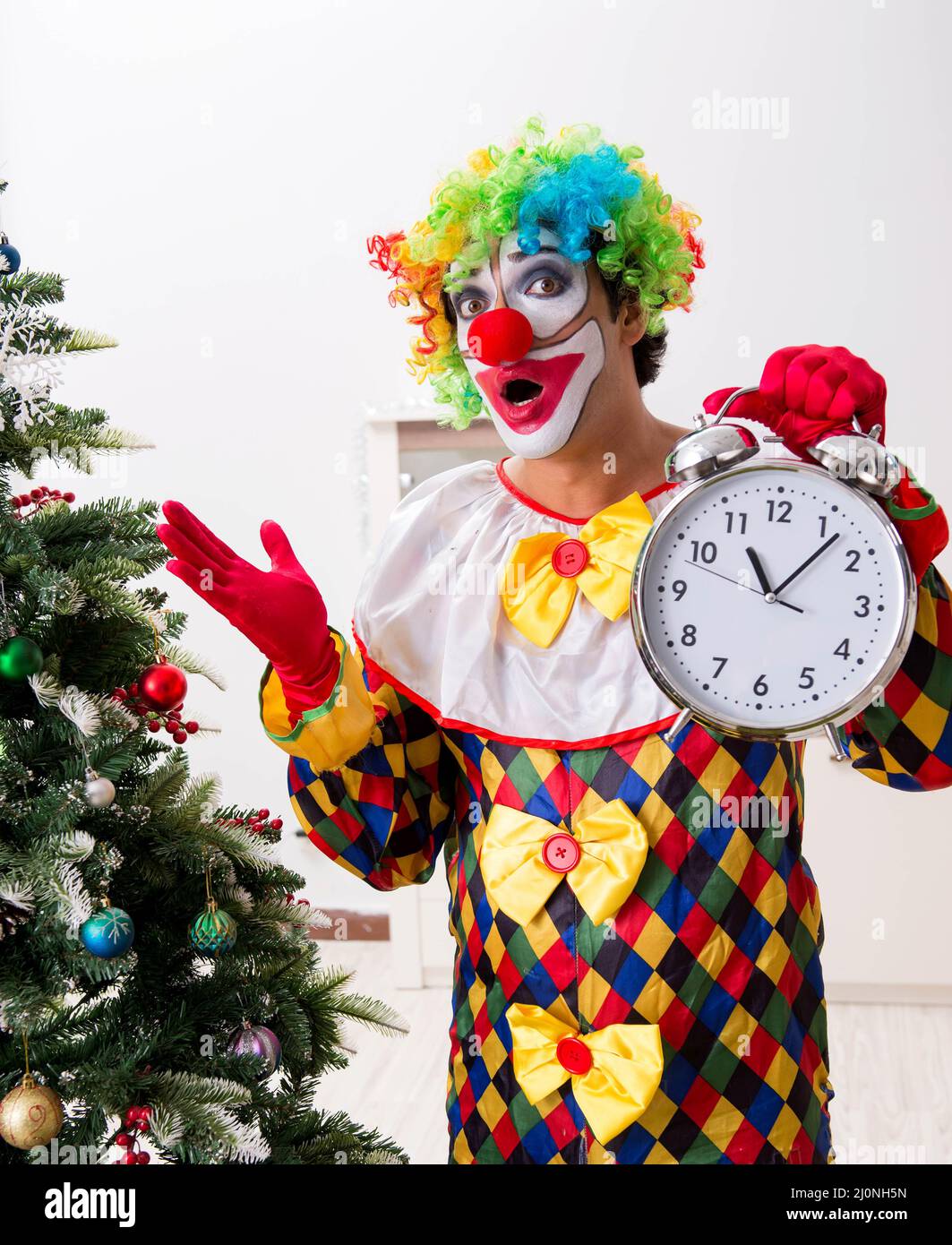 Funny clown in Christmas celebration concept Stock Photo - Alamy