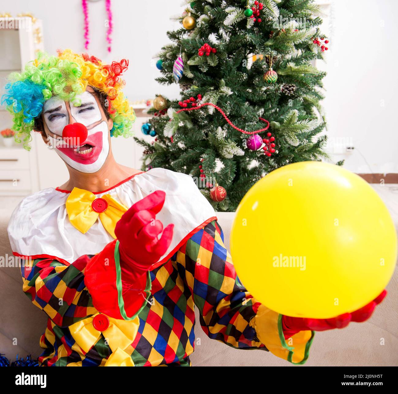 Funny clown in Christmas celebration concept Stock Photo - Alamy