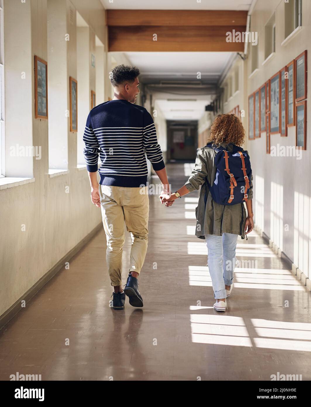 School couple hallway walking hi-res stock photography and images - Alamy