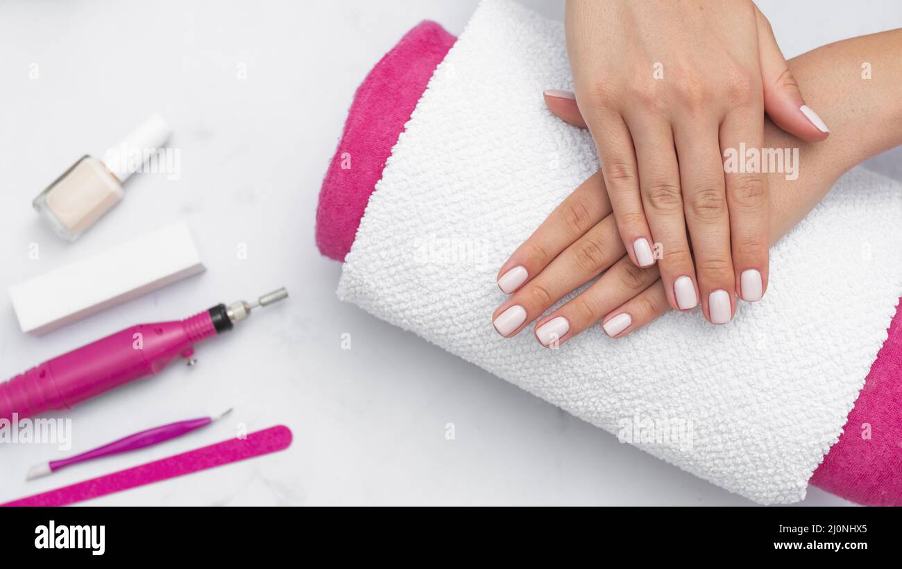 Woman getting her manicure done at the salon. High quality and ...