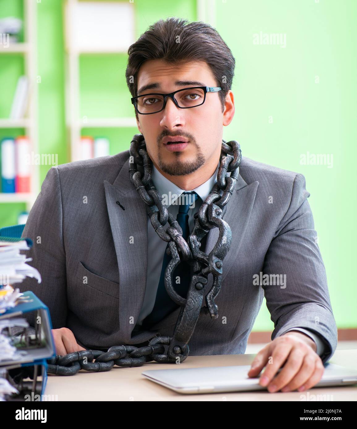 Man chained to desk hi-res stock photography and images - Alamy