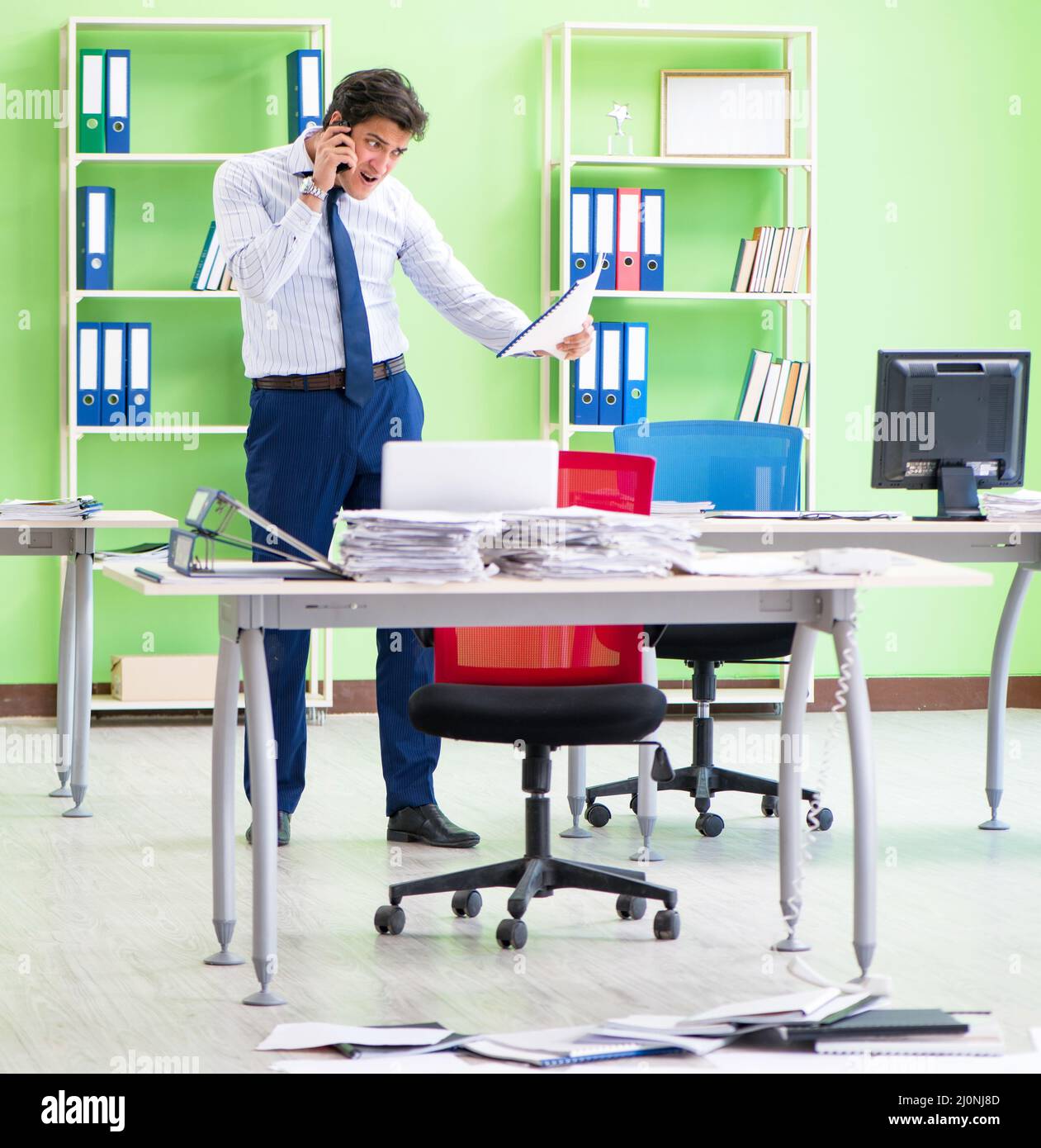 Frustrated businessman stressed from excessive work Stock Photo - Alamy