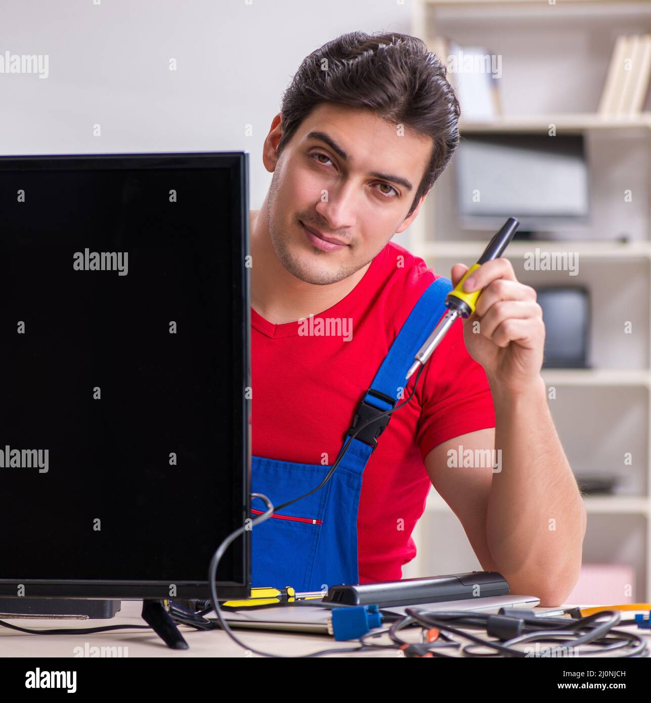 Professional repair engineer repairing broken tv Stock Photo - Alamy