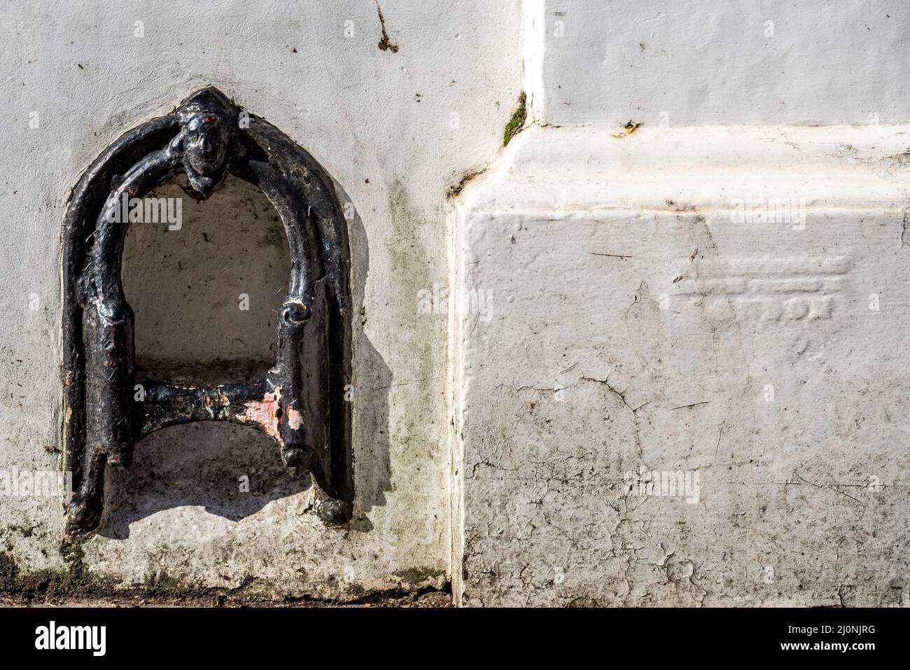 Vintage boot scraper built into the wall of a property in Holland Park ...
