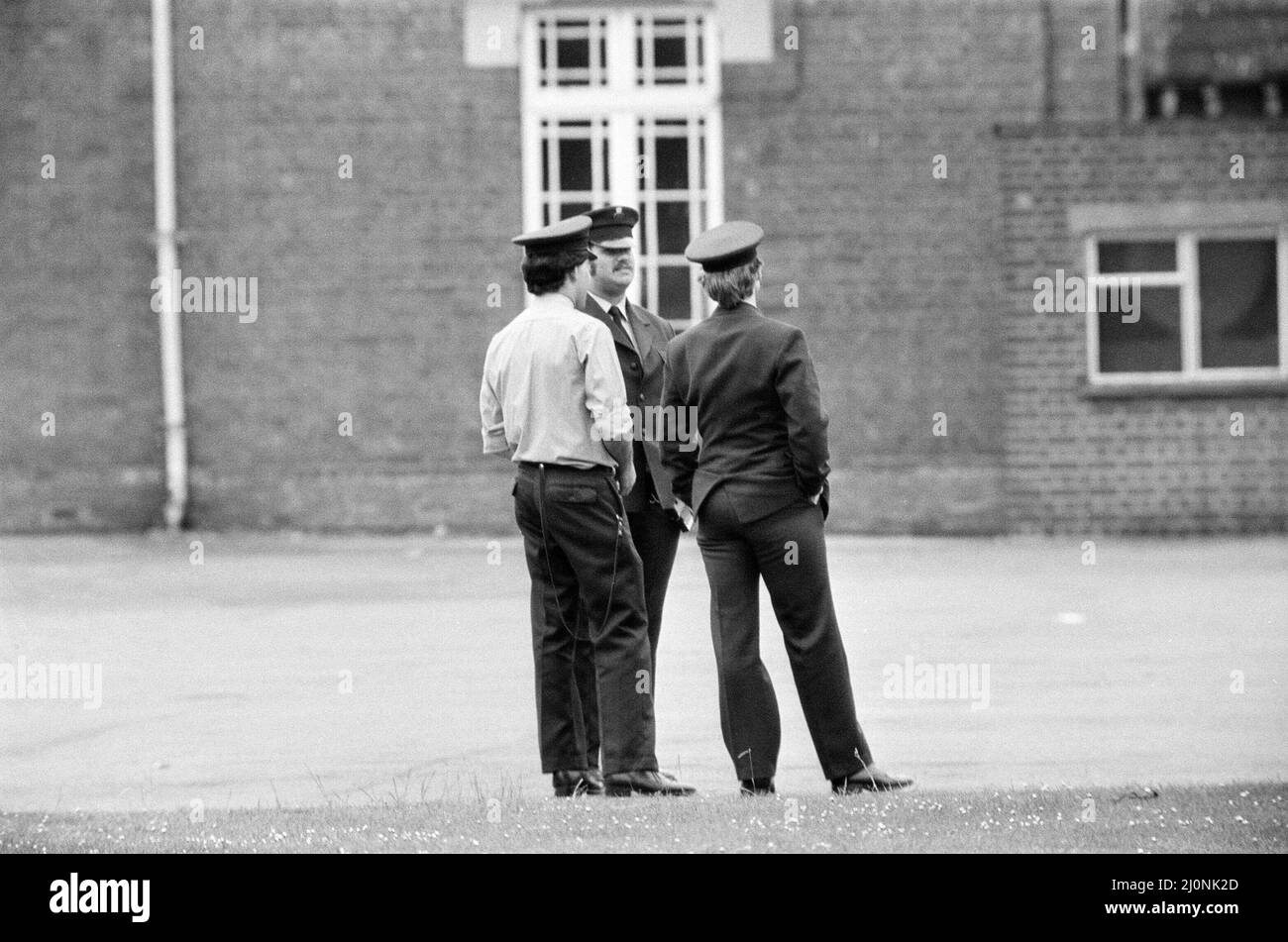 Policemen watch as Michael Peterson (aka Charles Bronson) stages a ...