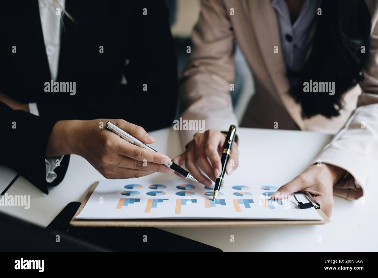 At the office desk, a company team is organizing a successful team ...