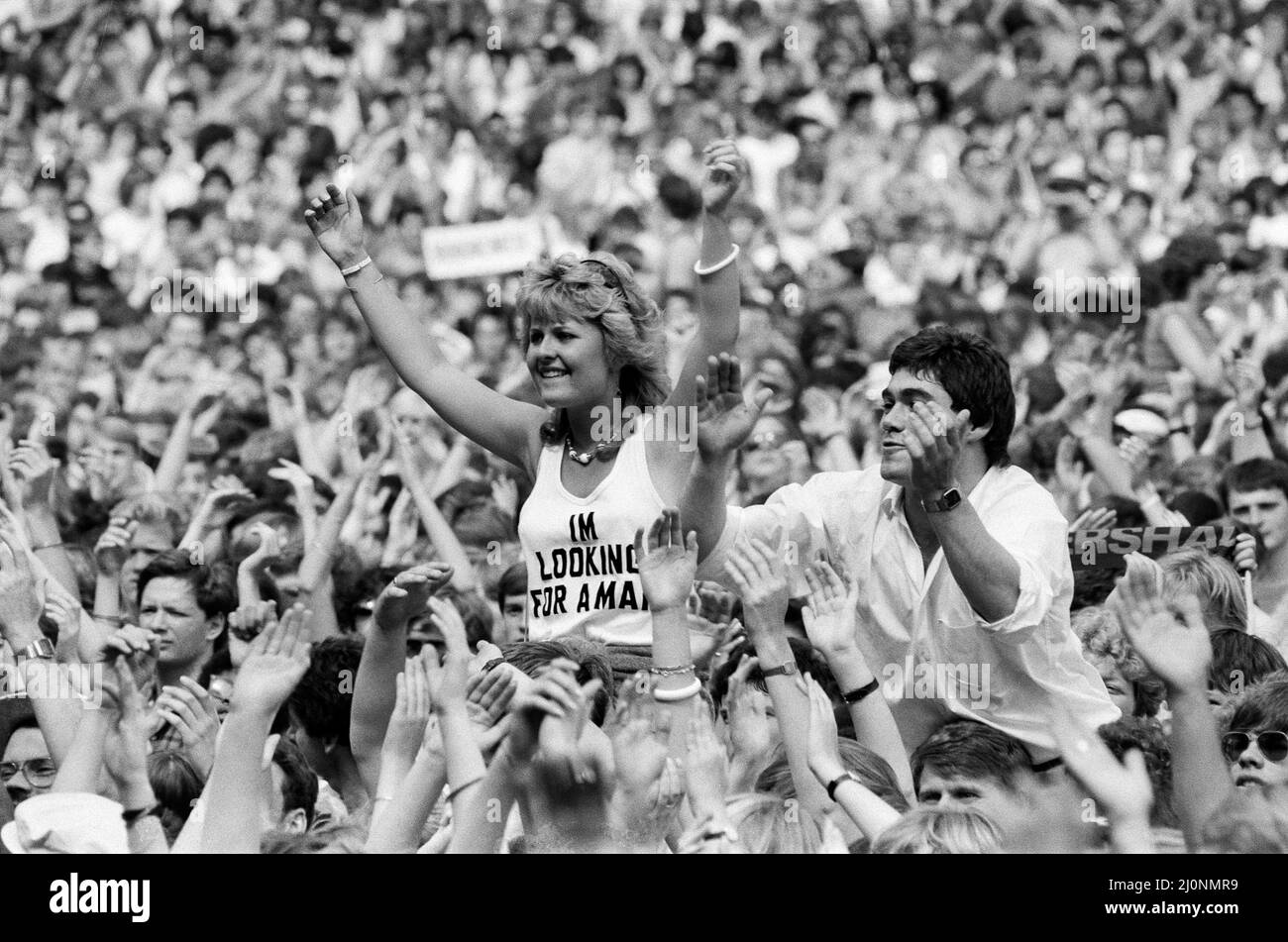 Fans at the "Summer of 84" concert at Wembley Stadium, which featured ...