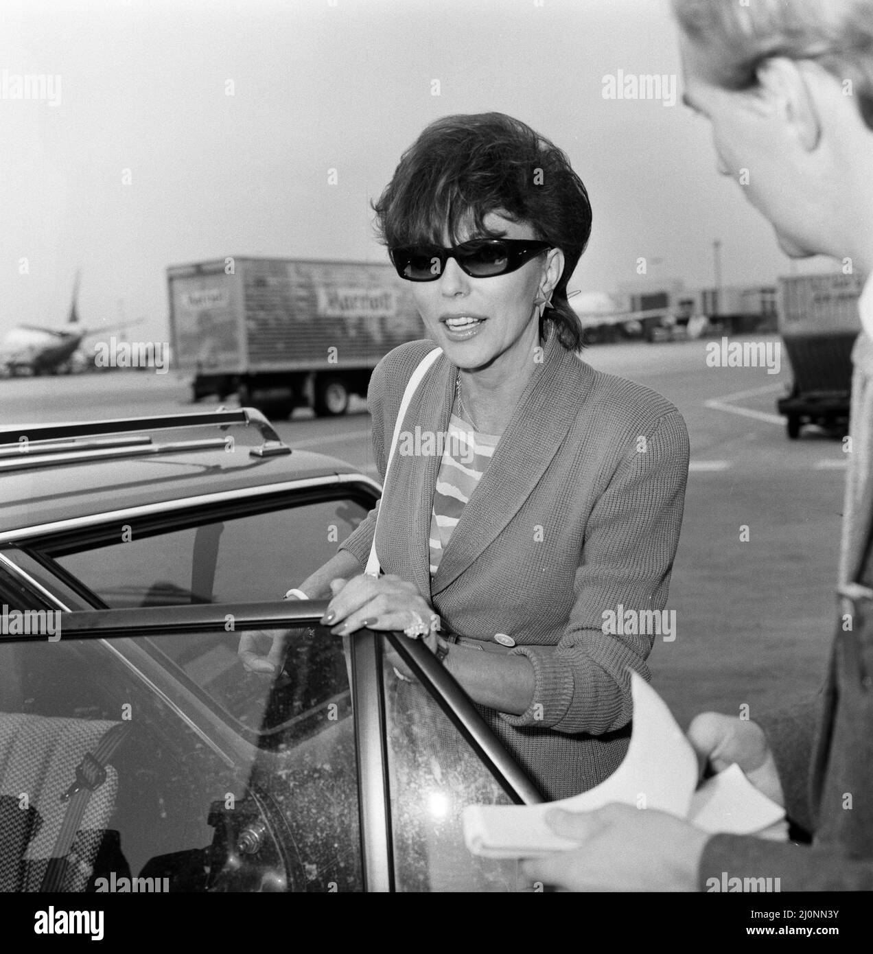 Joan Collins with her son Sacha, 17, arriving at Heathrow from Los ...