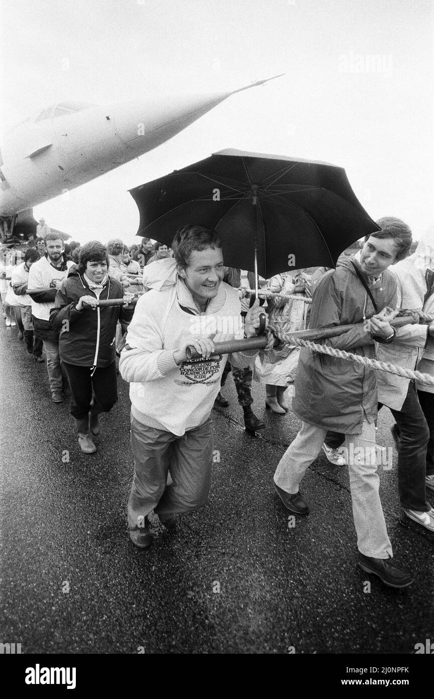 Hundreds of people were drenched by heavy rain as they pulled Concorde ...