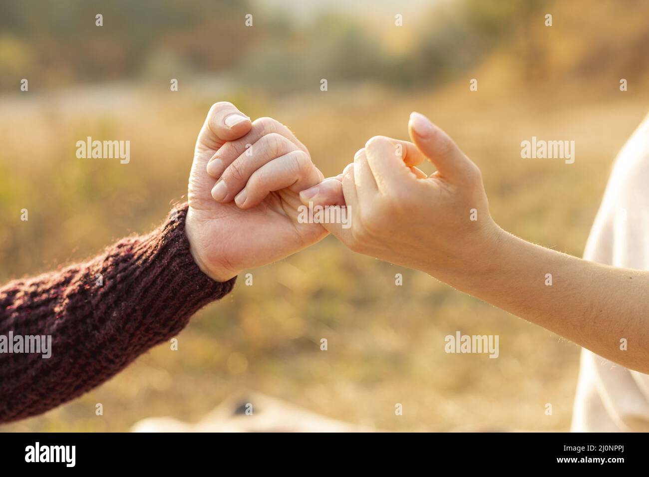Man woman making pinky promise (1) . High quality and resolution ...
