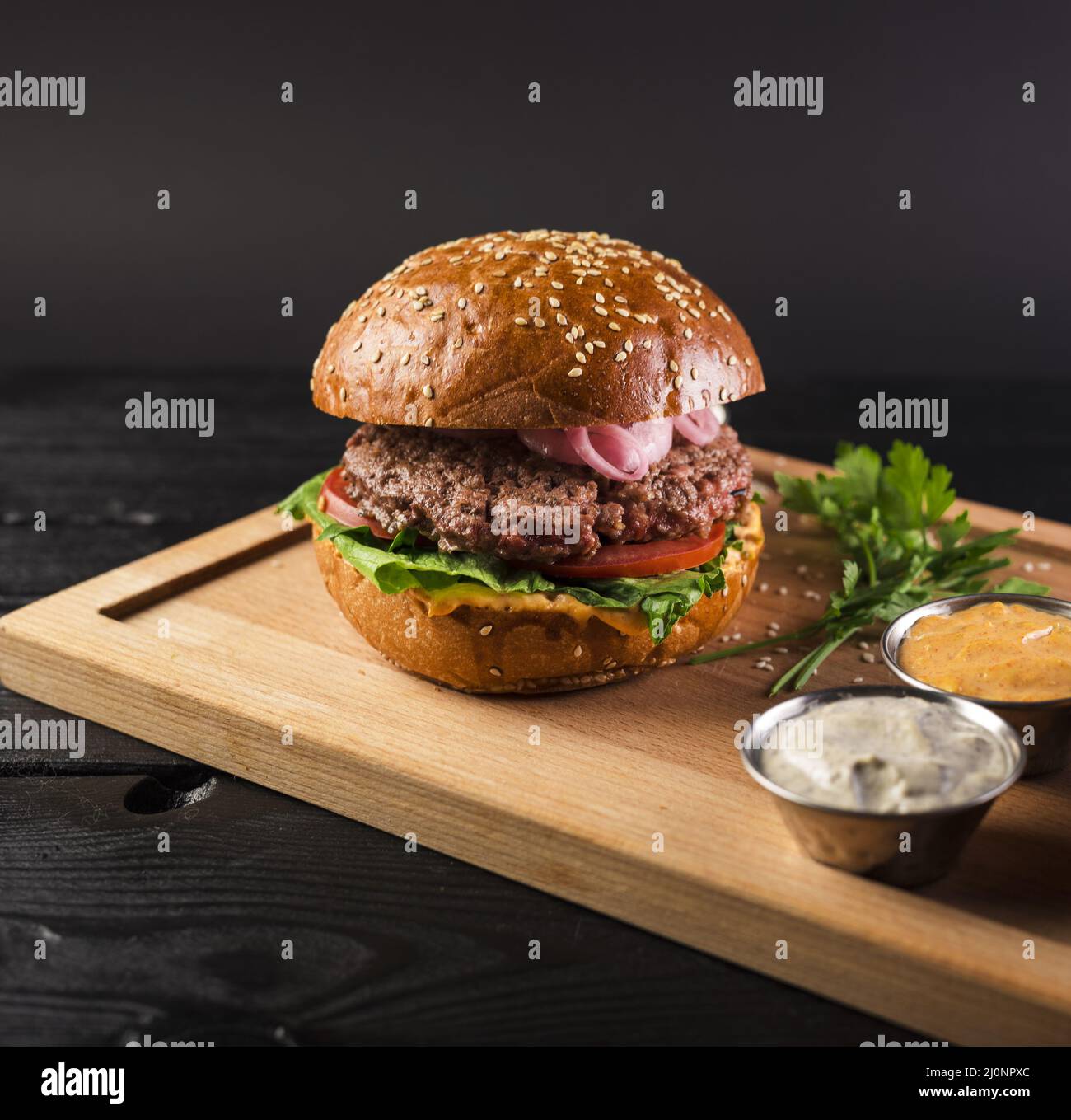 Tasty cheeseburger wooden board ready be served. High quality and ...