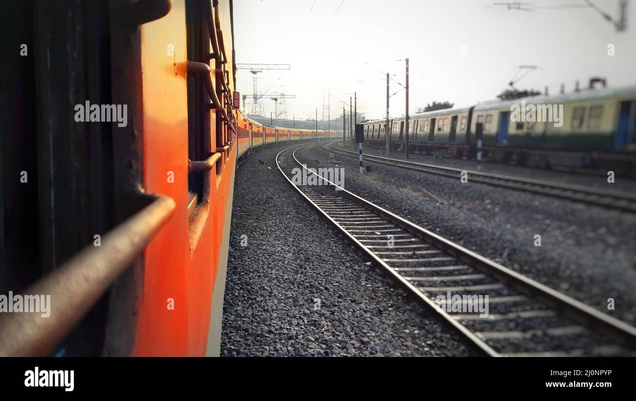 Beautiful morning image .Two Indian train with rail. perfect to show ...