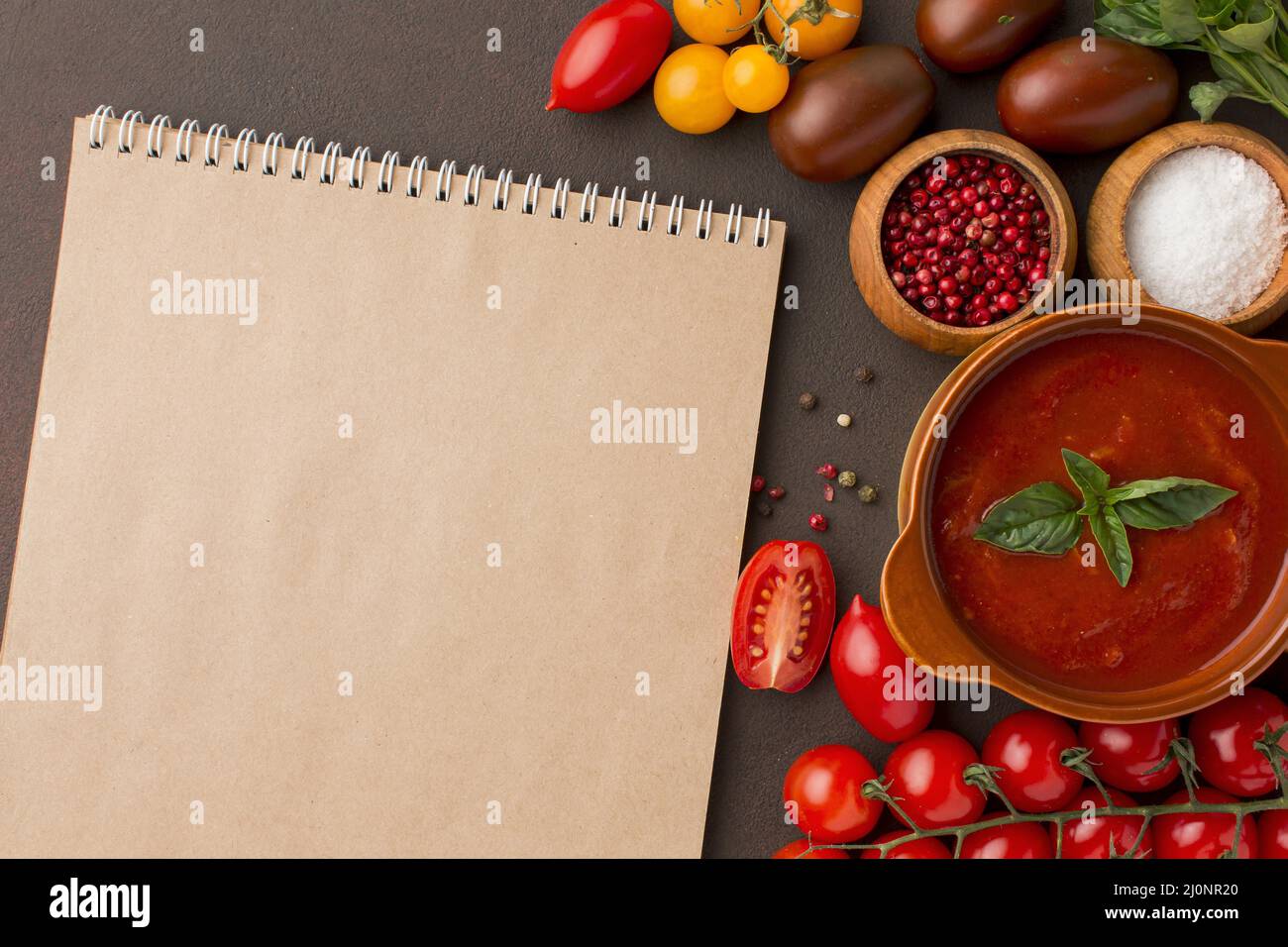 Top view winter tomato soup bowl with notebook. High quality and ...