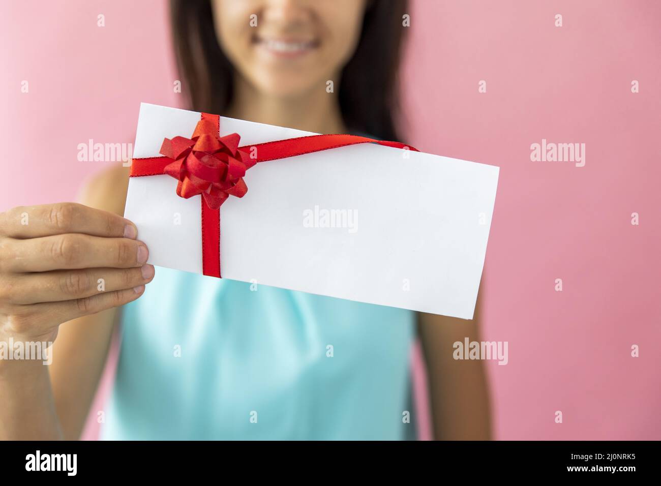 Smiley woman showing envelope. High quality and resolution beautiful ...