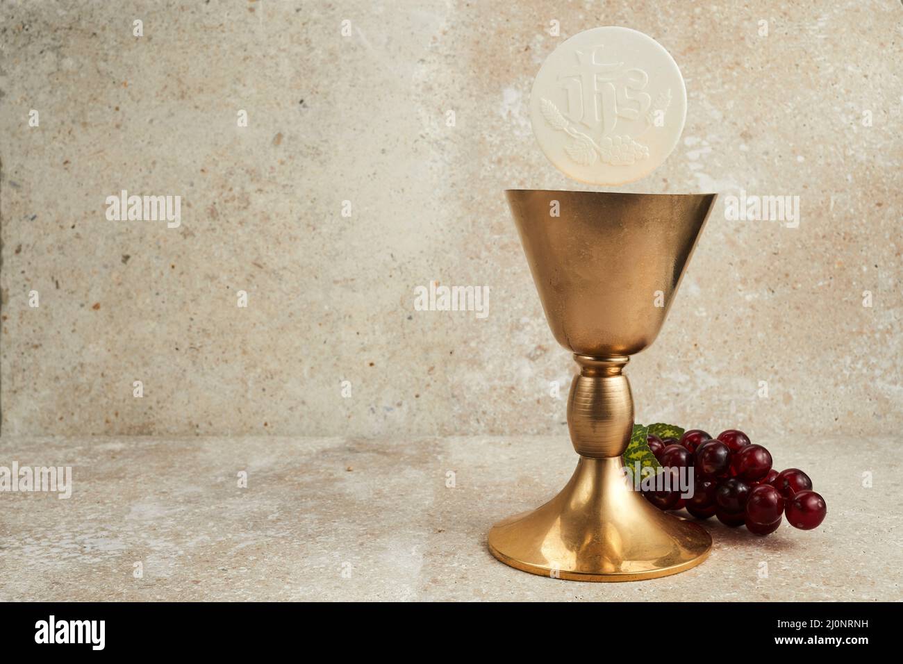 Christian holy communion with Chalice on stone background Stock Photo ...