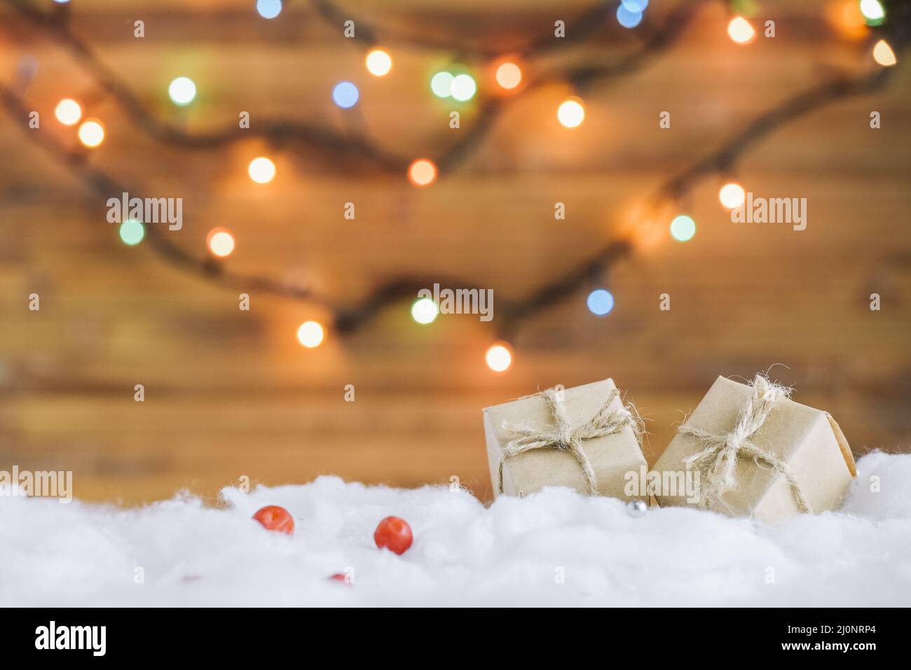 Present boxes decorative snow near fairy lights . High quality and ...