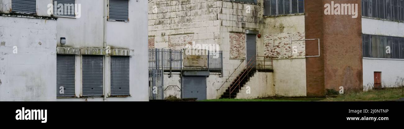 Office window shutters closed due to business closure Stock Photo - Alamy