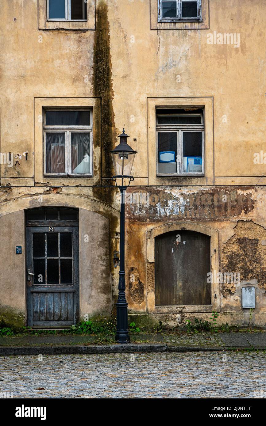 Street lamp in front of old facade with windows Stock Photo - Alamy