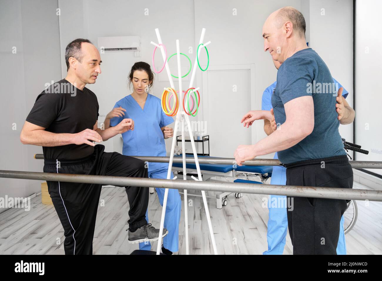 Group of People with disability exercising at rehabilitation clinic ...