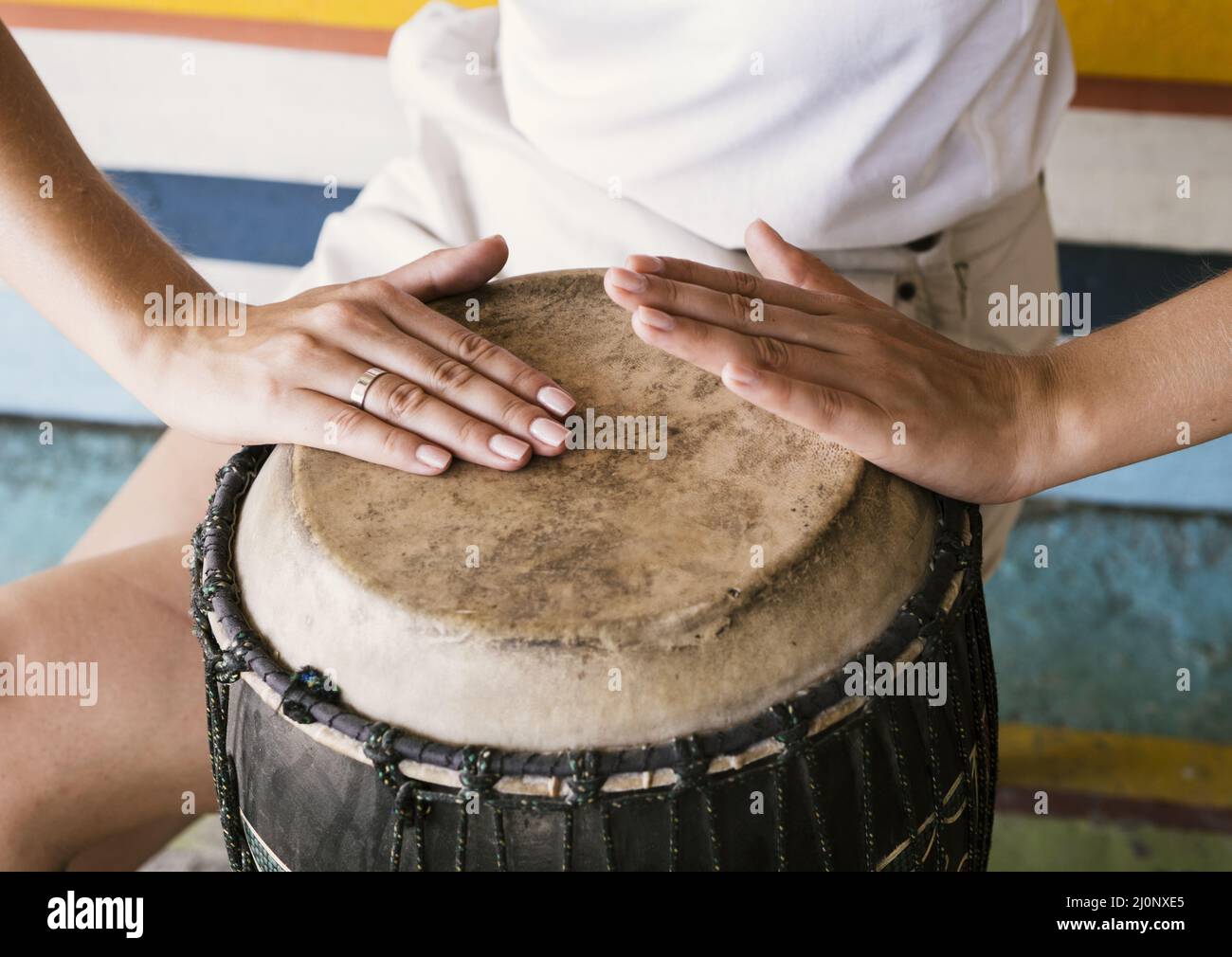 Young person playing yuker drum (1). High quality and resolution ...