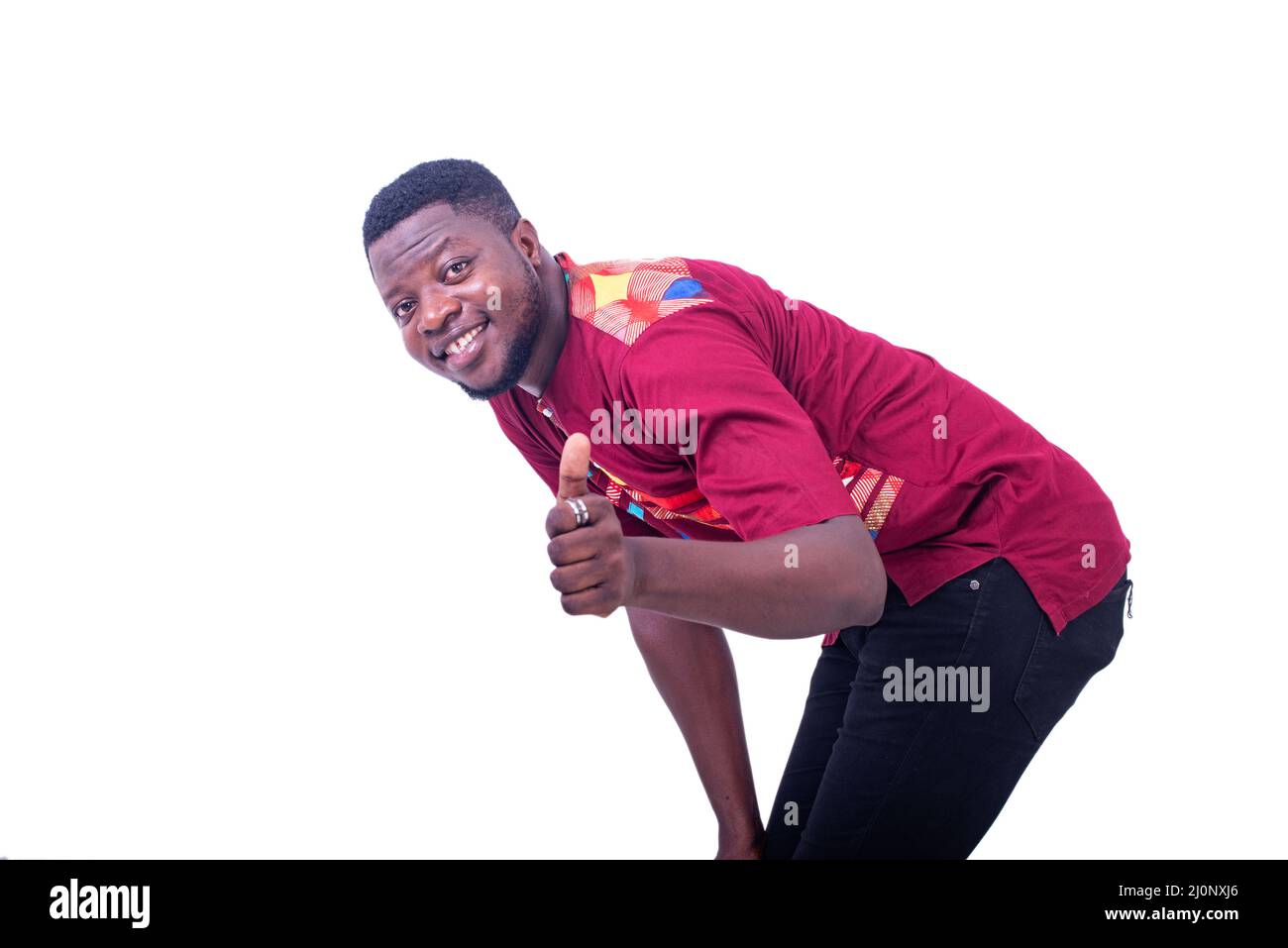 portrait of a handsome young curved man showing his thumb and smiling ...