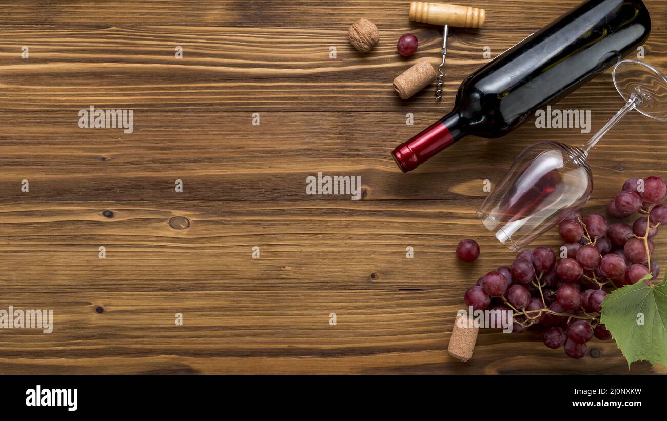 Top view wine bottle with glass wooden background. High quality and ...