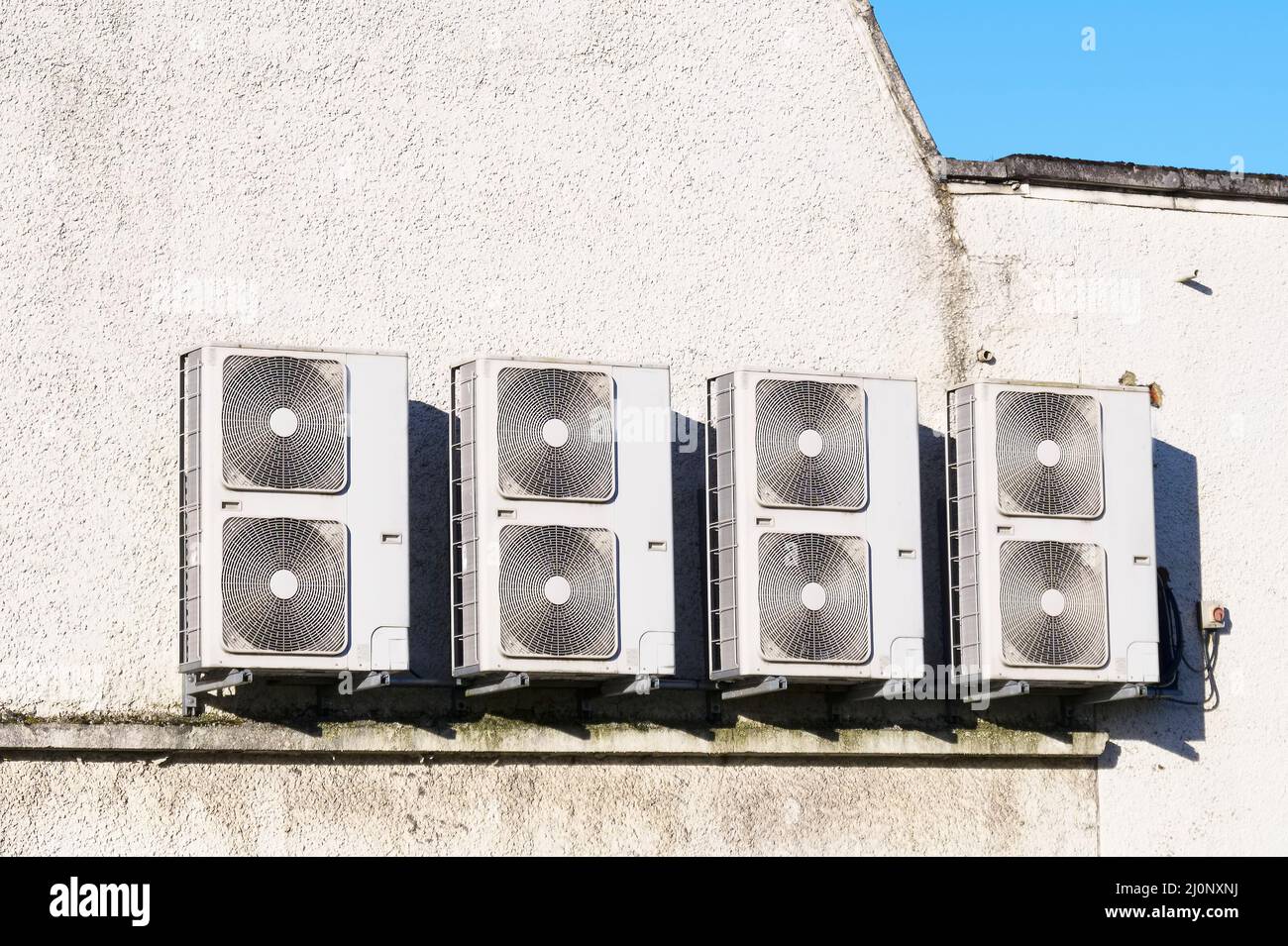 Condenser units for air conditioning system wall mounted outdoors Stock ...