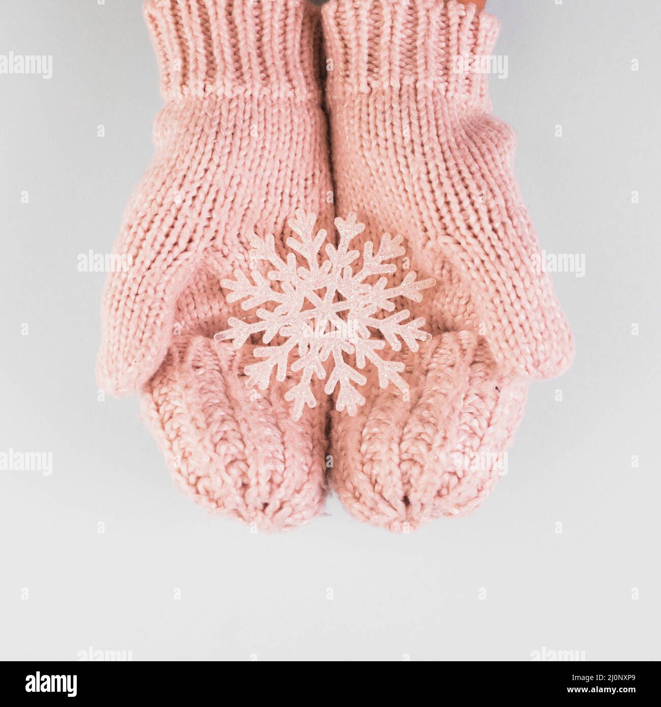 Person hands in mittens with paper snowflake . High quality and ...