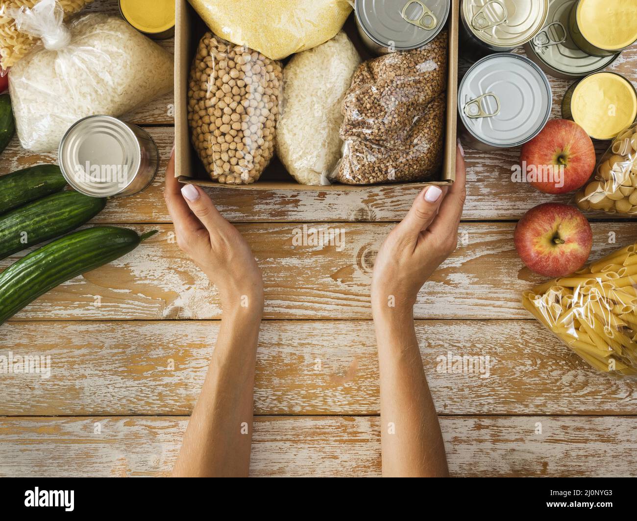 Charity giving food hands hi-res stock photography and images - Alamy